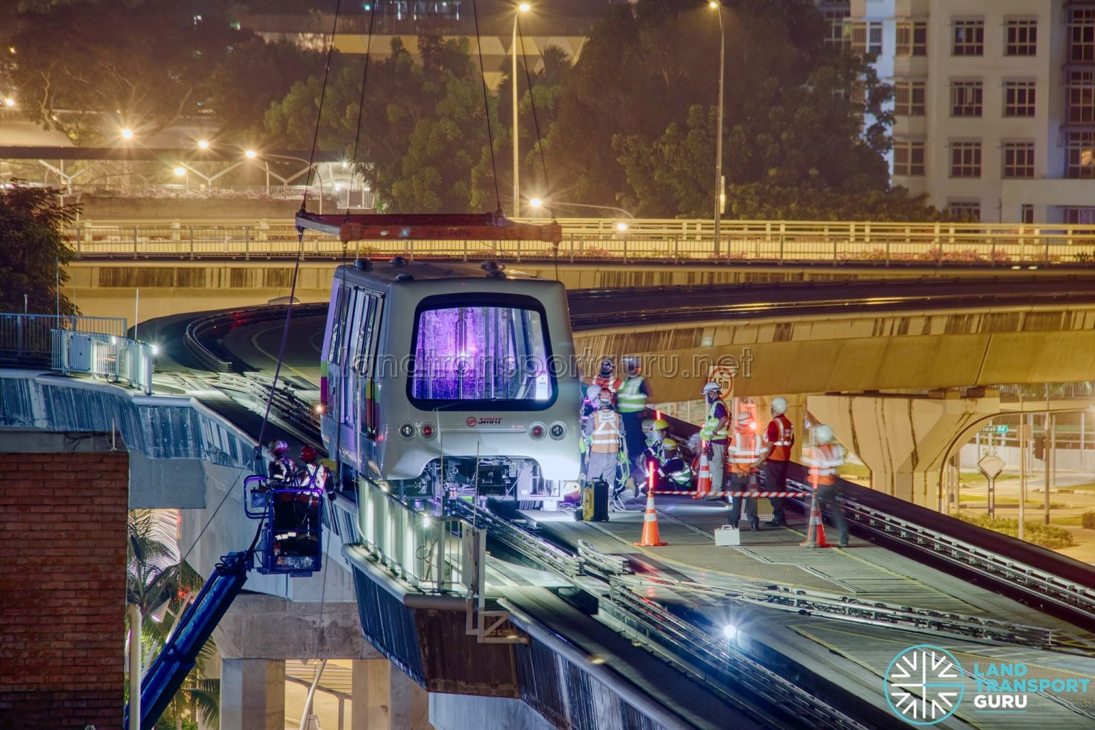 Securing of BPLRT C801A Light Rail Vehicle (Car 131) onto guideway ...